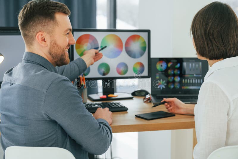 Talking with Each Other about New Ideas. Two Designers Working Together ...