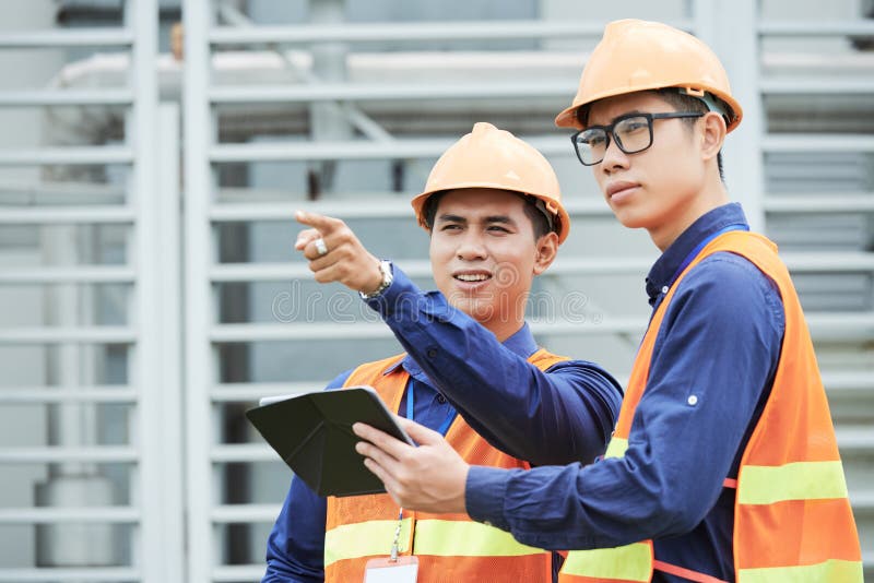 Talking engineers stock image. Image of worker, facility - 124453619