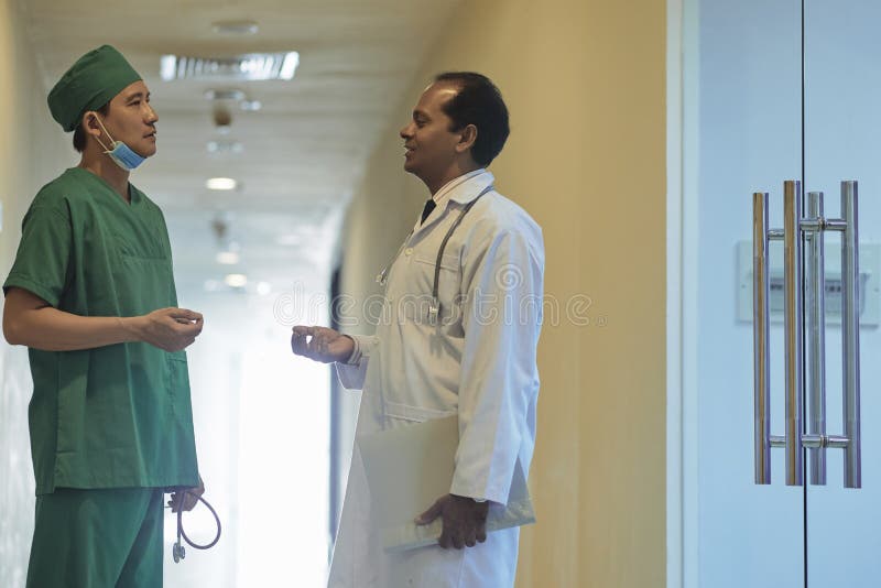 Talking medical workers stock photo. Image of asian - 139444822