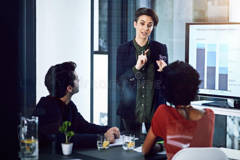 Talking Over the Main Points. a Young Businesswoman Giving a ...