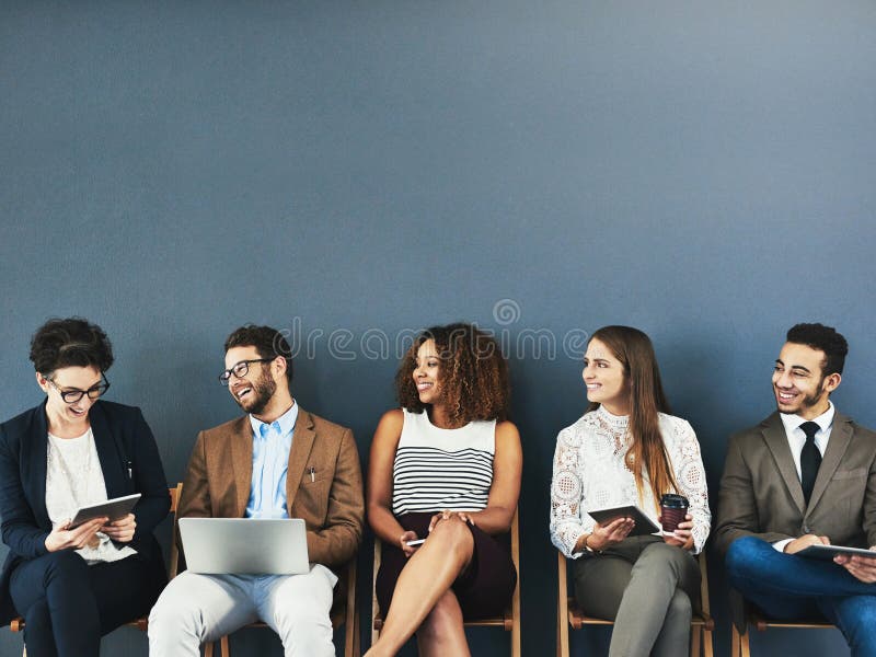 Talking To Pass the Time. Studio Shot of a Group of Businesspeople ...