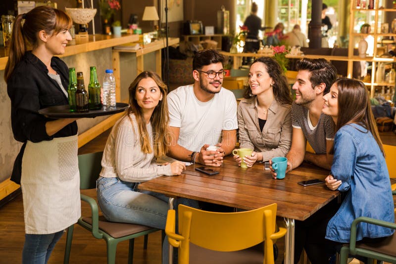 Talking to the waitress stock image. Image of cafe, interior - 124604503