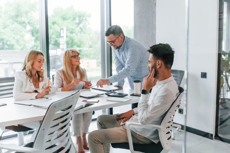 Talking and Working on the Project Together. Group of Professional ...