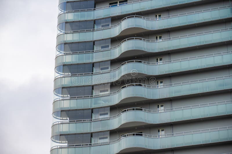 Tall Apartment Building with Balconies Along the Whole Facade.. Stock ...