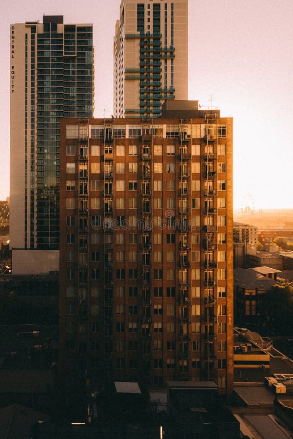 Tall Apartment Building with a Beautiful Sunset in the Background Stock ...