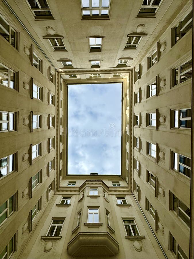 Tall Apartment Building with a Blue Sky Backdrop Stock Photo - Image of ...