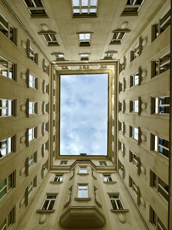Tall Apartment Building with a Blue Sky Backdrop Stock Photo - Image of ...