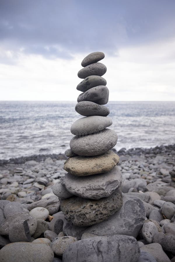 Tall Balanced Stack of Pebble Stones on a Stony Beach in Madeira Stock ...