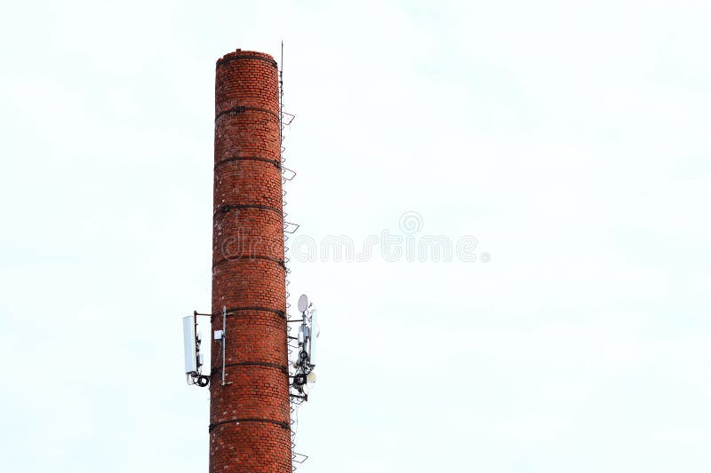A Tall Brick Chimney with a Clock on Top, Suitable for Use in ...