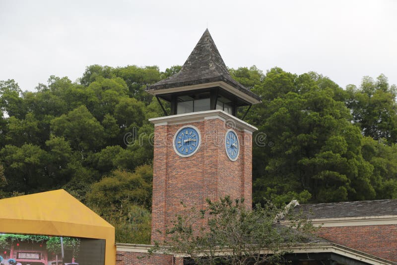 A Red Brick Clock Tower with Two Blue Clocks on it, Located in the ...