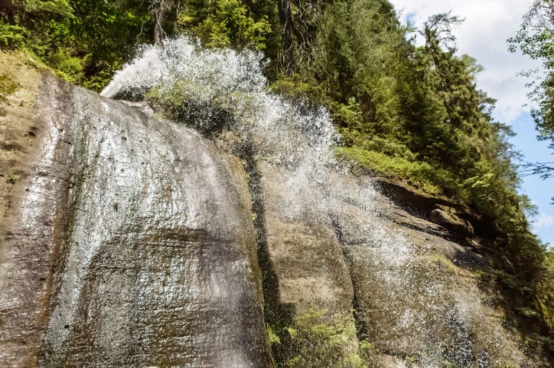 A Tall and Broad Mountain with Greenery Above and Around it Stock Image ...