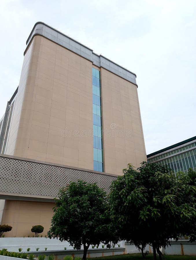 A Tall Brown Tower Stands Prominently Against a Backdrop of White ...
