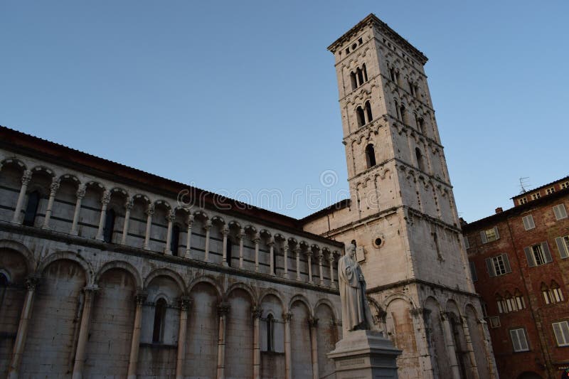 A Tall Building with a Clock Tower in Front of it Editorial Stock Photo ...