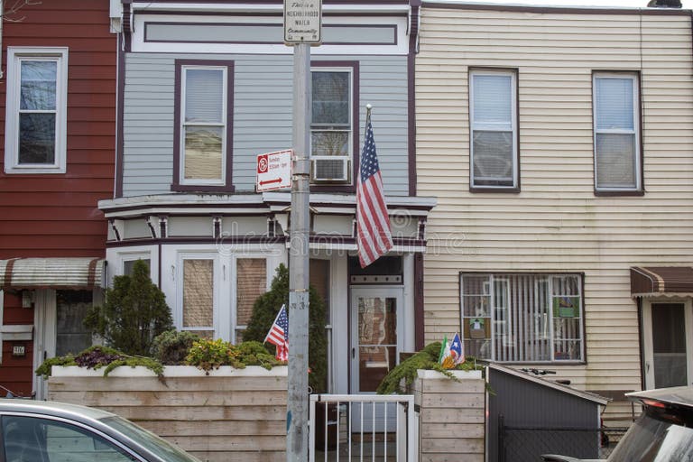 A Large Building with a Pole in Front of it with a Flag Editorial Stock ...