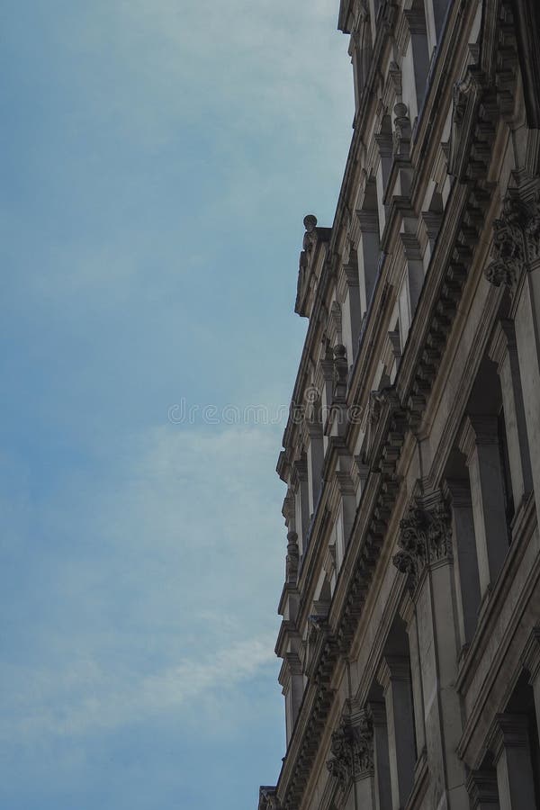 Tall Building Flanked by Decorative Pillars Stock Photo - Image of ...