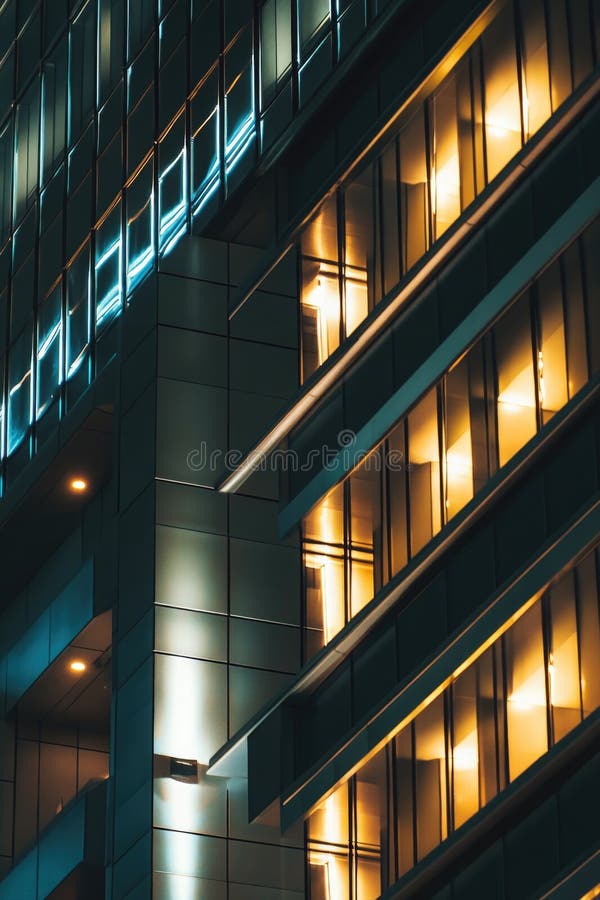 Tall Building with Illuminated Windows Stock Image - Image of lighting ...