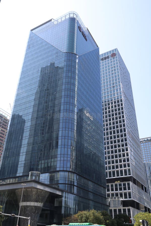 A Tall Building with a Large Window on the Side Stock Image - Image of ...