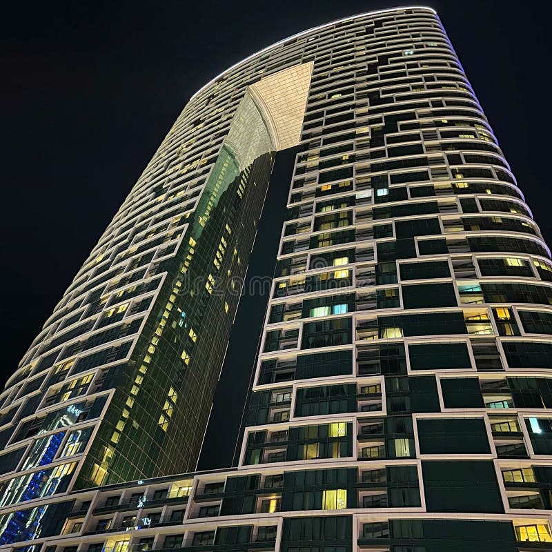 Tall Building with Lit Windows at Night Stock Image - Image of exterior ...