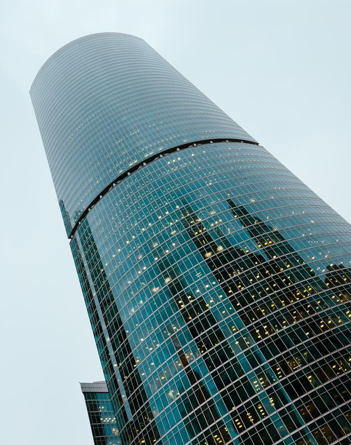 A Tall Building with a Lot of Windows and a Blue Tint Stock Image ...