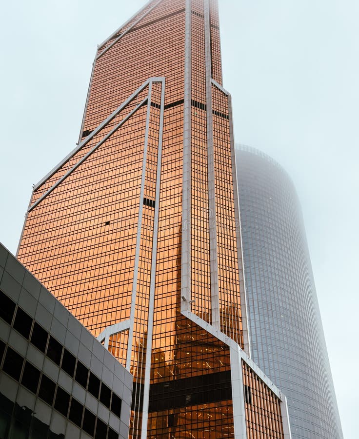 Tall Building with Many Windows Stands Next To Street Stock Photo ...