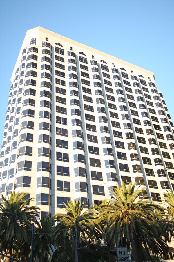 Tall Building & Palm Trees Stock Photo - Image of trees, architecture ...