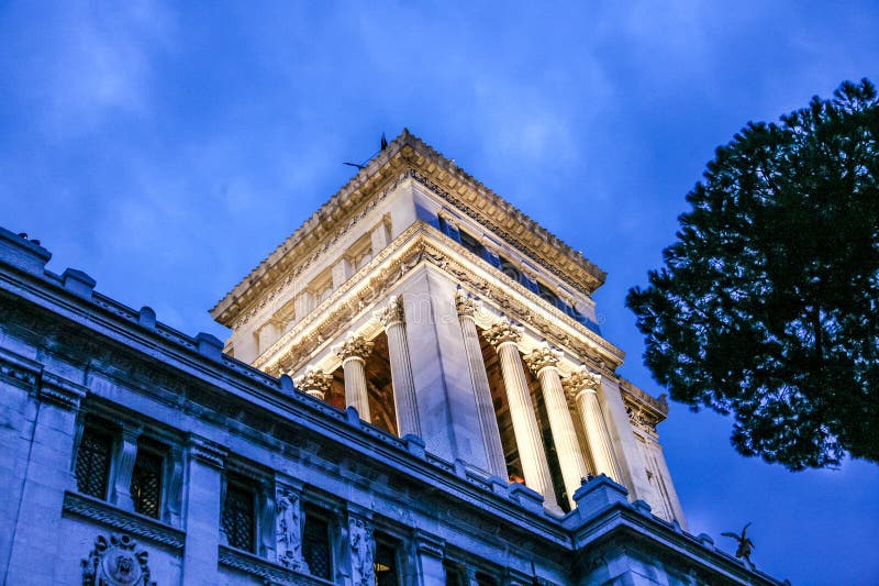 A Tall Building in Rome Italy with a Large Window on the Top Stock ...