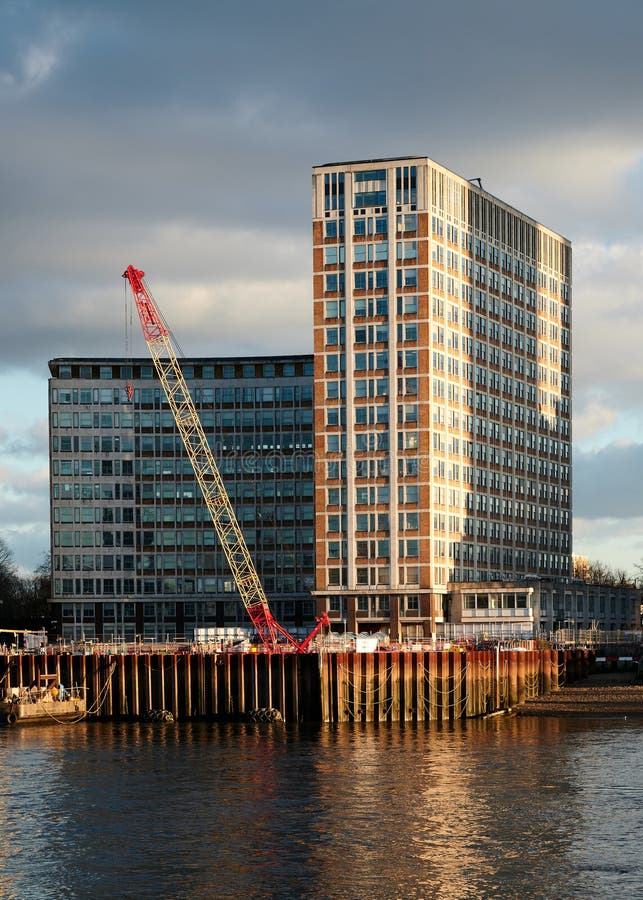 Tall Building in Sunshine with Crane in Front of River Thames in London ...