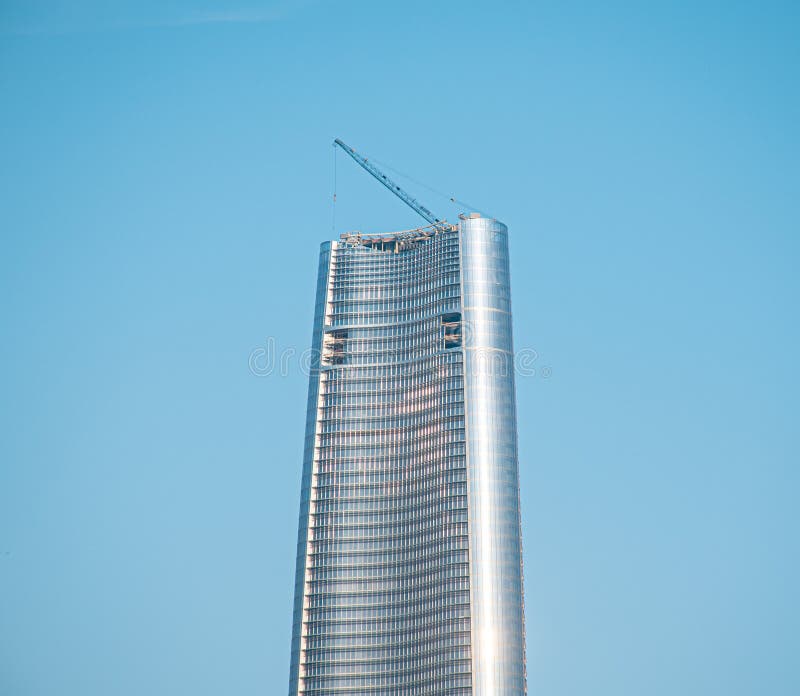 Tall Building with a Tower Reaching Up Towards it Stock Image - Image ...