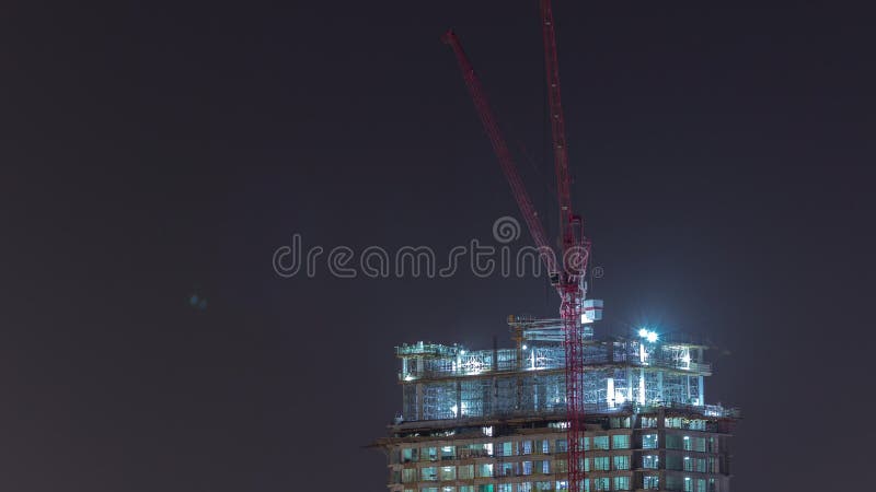 Tall Building Under Construction and Cranes Night Timelapse Editorial ...
