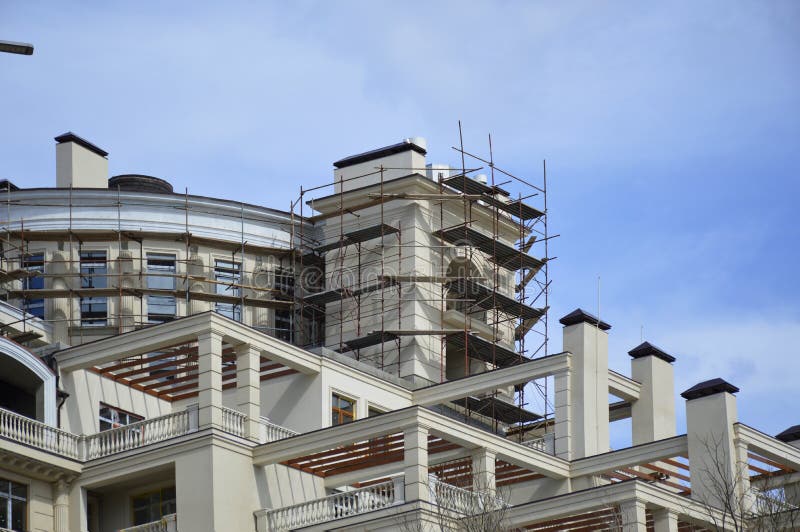 Tall Building Under Construction with Scaffolding for External Wall ...