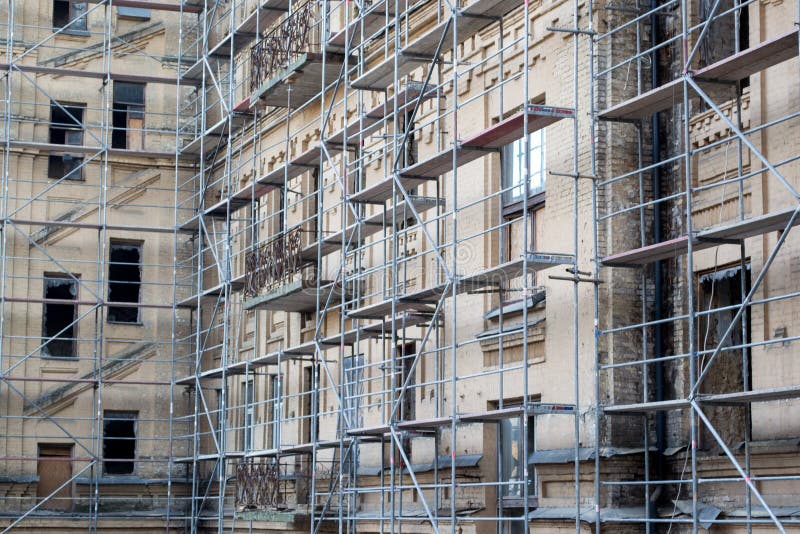 Tall Building Under Construction with Scaffolds. Scaffold. Construction ...
