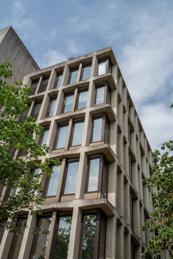 Tall Buildings with Lots of Windows in Front of Them Against a Blue Sky ...
