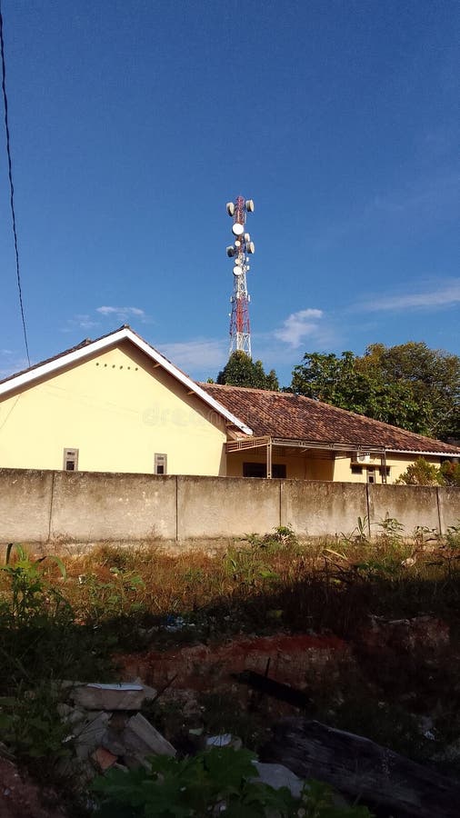 Tall Cellular Tower Behind the House Stock Photo - Image of tower, tall ...