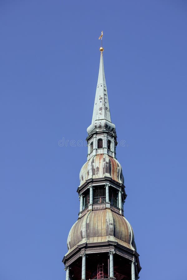 .a Tall Church Tower with a Gilded Rooster at the Top of the Tower ...