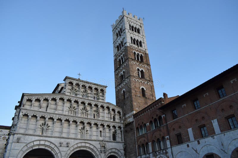 A Tall Tower with a Clock on it and a Building in the Back Editorial ...
