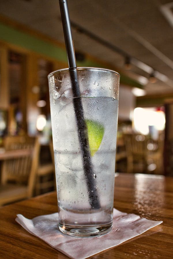 Tall Icy Cold Glass of Water with Water Drops on Glass Table Stock ...