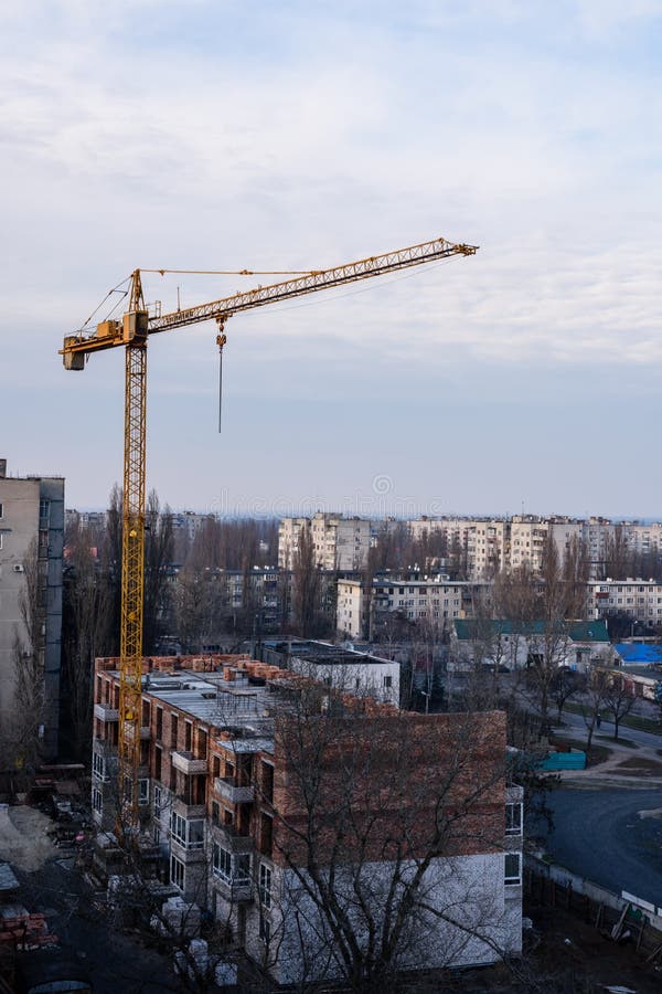 Tall Construction Crane at a Building Site Stock Photo - Image of ...