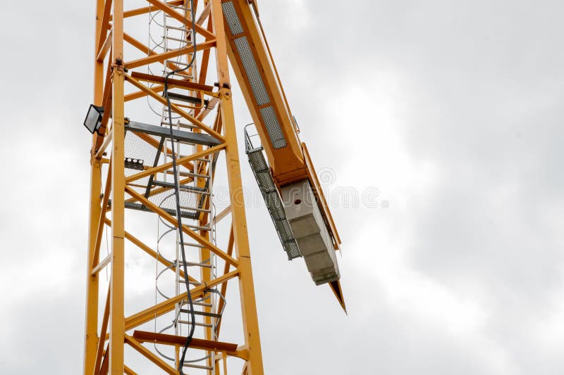 A Tall Crane on a Construction Site, Blue Sky. Construction Crane in ...