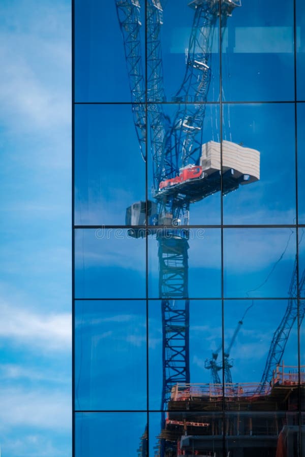 Tall Crane Reflected in Mirrored Windows of Skyscraper in Charlotte ...