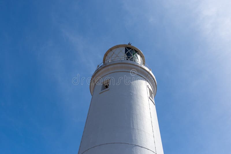 Tall White Lighthouse Seen from Below Against Blue Sky Stock Image ...