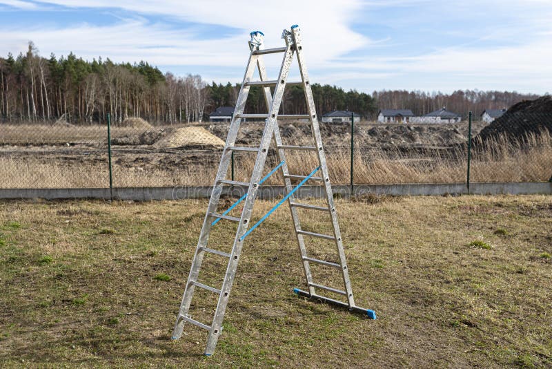 A Tall, Fold-out Aluminum Ladder Standing in the Yard, in the Shape of ...
