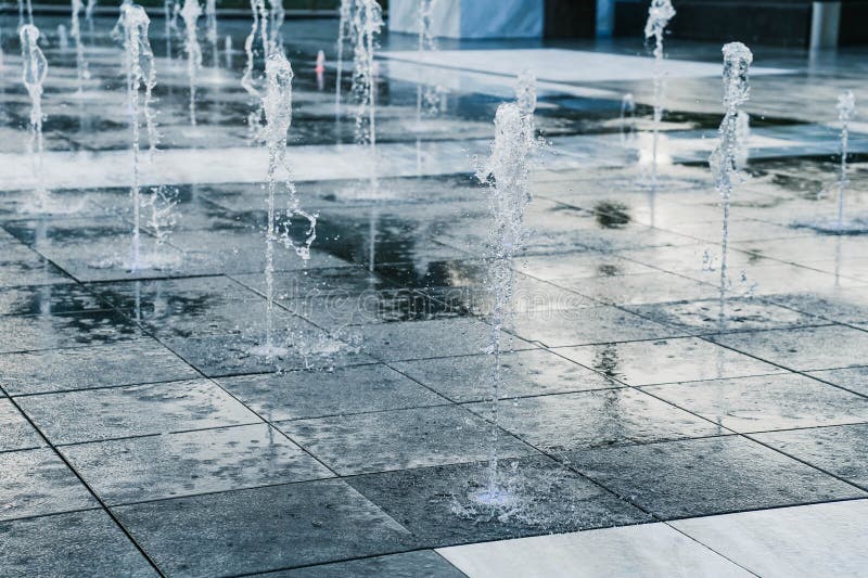 A Tall Fountain that Shoots Down from the Ground Stock Image - Image of ...