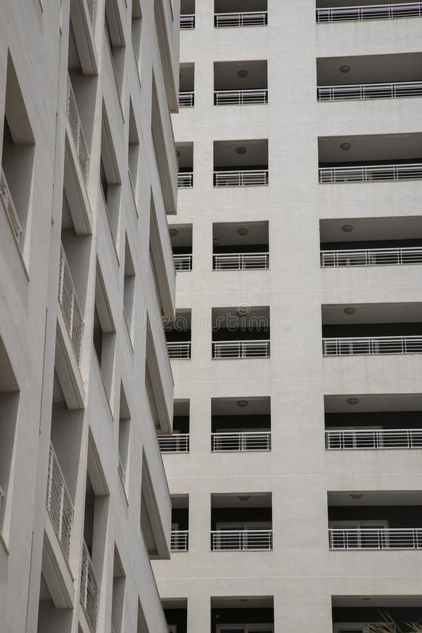 A Tall Gray Building with Balconies on Each Floor Stock Image - Image ...