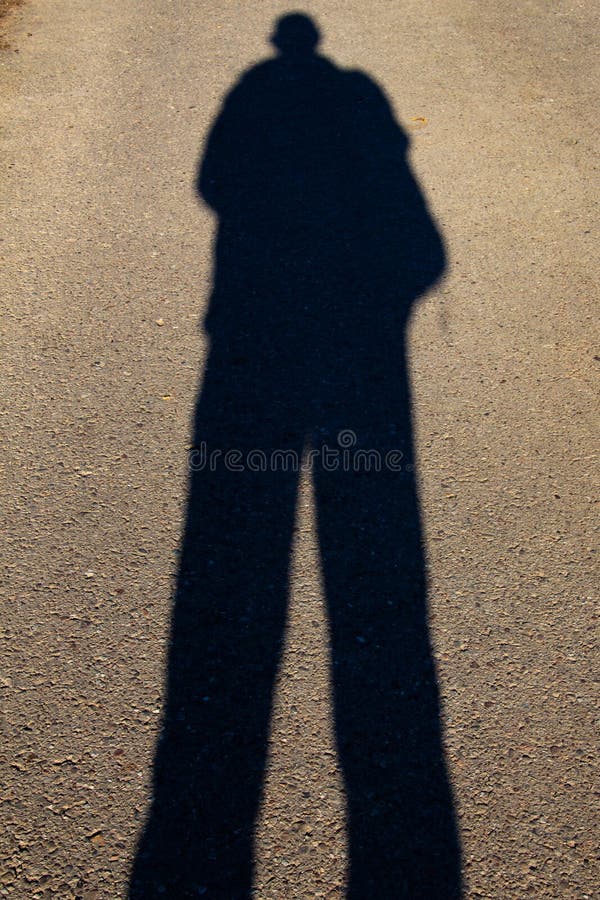 Tall Human Shadow on a Road Stock Image - Image of figure, shadows ...