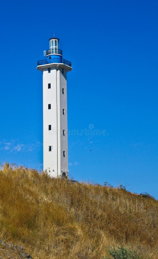 Tall lighthouse stock photo. Image of blue, grass, cloud - 21164232