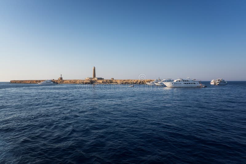 Tall lighthouse on the sea stock image. Image of light - 164554589