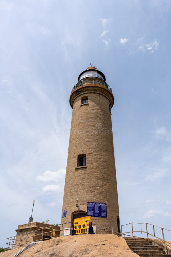 A Tall Lighthouse Stands on a Rocky Hill Stock Image - Image of ...
