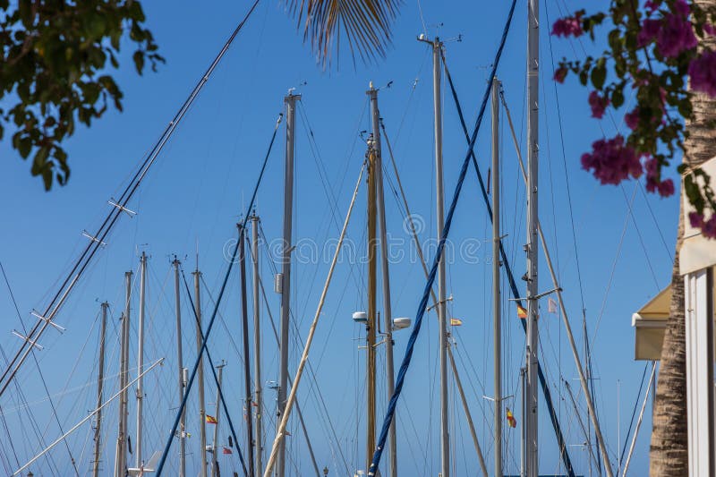 Tall Masts of Ships in the Harbor. the Background is Blue Sky Stock ...