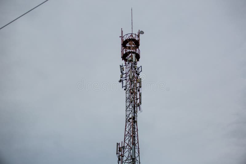 Tall Metal Antenna Tower with Multiple Antennas Pointing Towards the ...