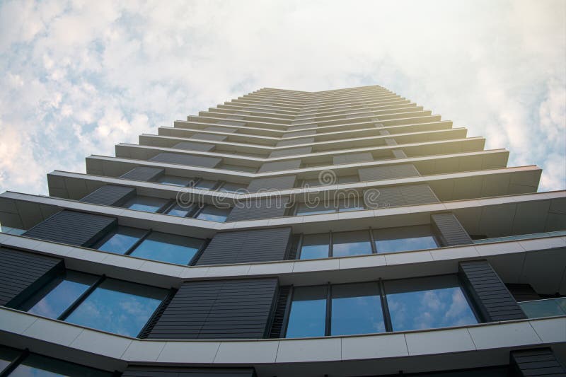 Tall Modern High Tech Style Building Agains the Sky with Clouds. Copy ...